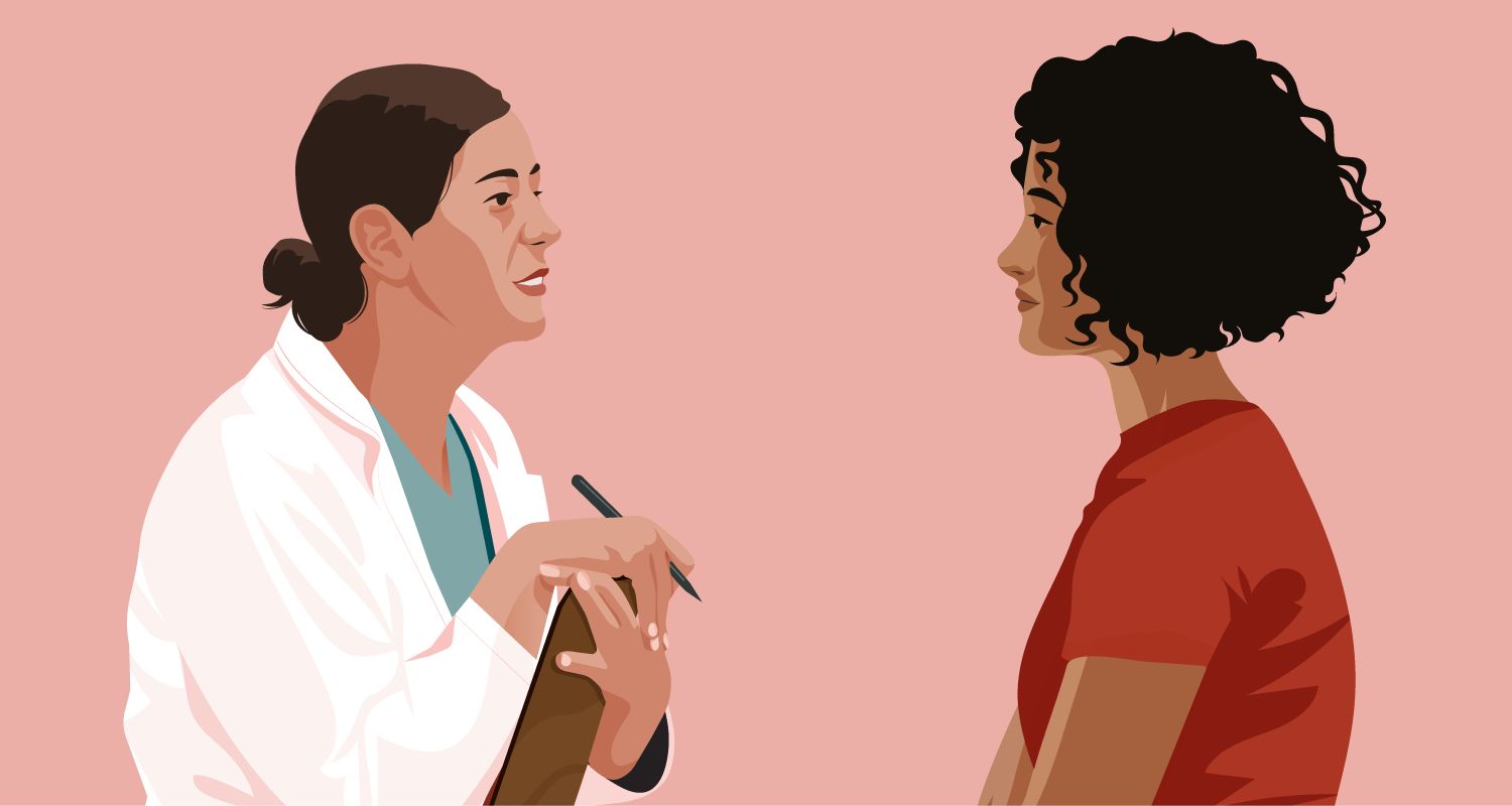doctor with a clipboard and pen talking to a patient