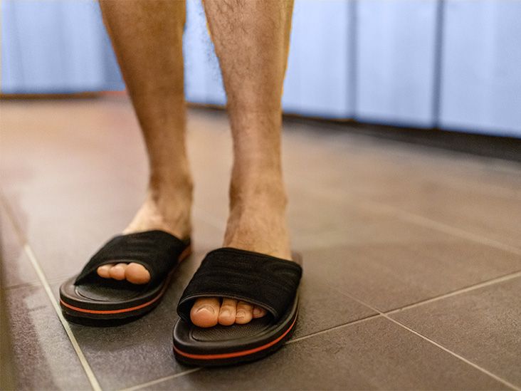 Why might red spots appear on the feet of a person with diabetes?
